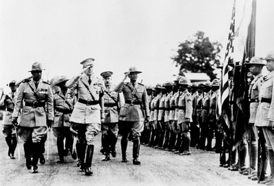 General MacArthur watches the Philippine troops.