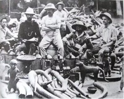 Military Men in Nigeria. with elephant teeth to sell.
