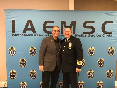 Director of Client Relations John Peruggia and IAEMSC President Peter ...