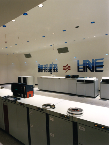 Colour image of the computer room and mainframe computers.