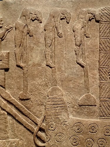 Assyrian carvings proudly displaying how they treated their enemies ...