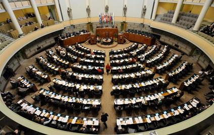 This image represents Parliament because it shows a group of people ...