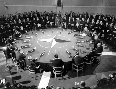 The opening speech takes place Dec. 14, 1957, at the NATO Summit