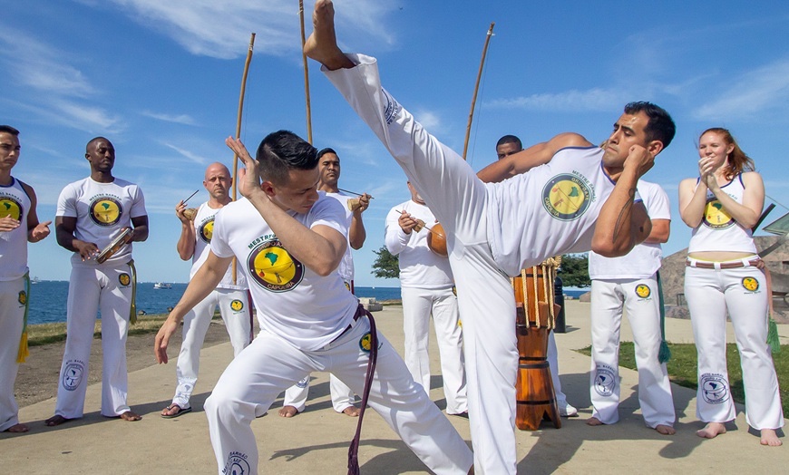 An image showing capoeiristas in their uniforms/attire. (Axé Capoeira ...