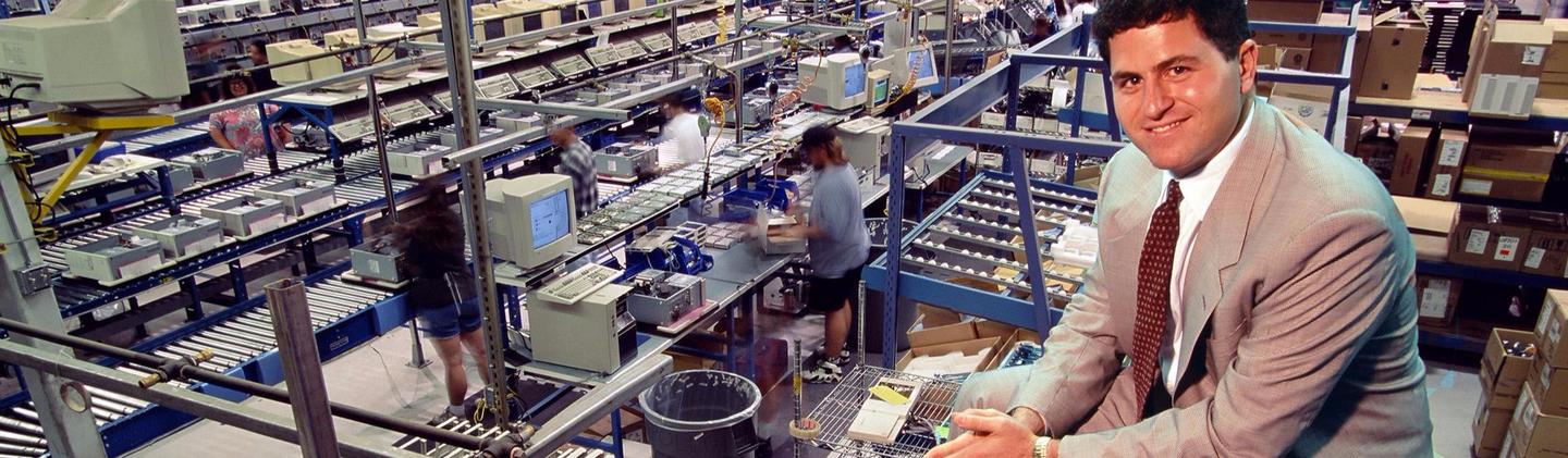 Michael Dell sitting in front of the headquarters of Dell technologies ...