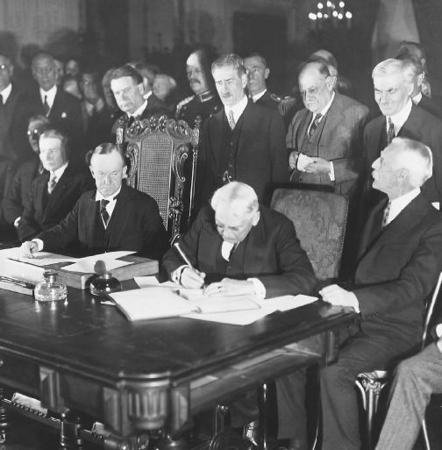 Delegates and many other dignitaries watch as one more signature is ...
