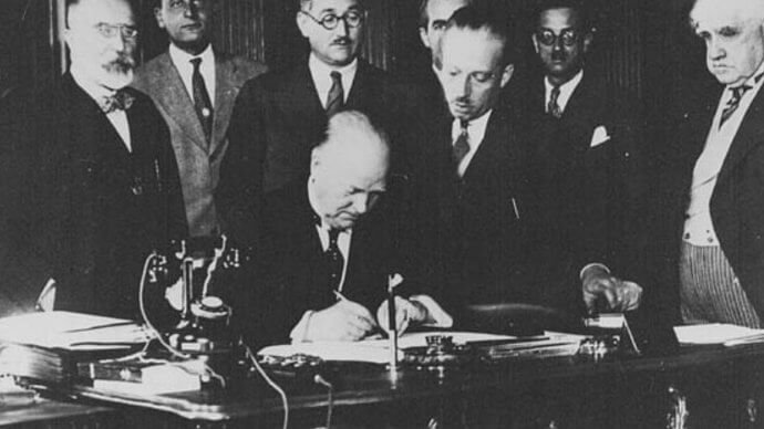 A picture taken of R.B. Bennett signing the Statute of Westminster.