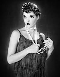 As you can see, this women has shorter hair, and is wearing a lot of ...