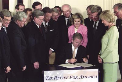 President George W. Bush signing the Act on June 7, 2001.