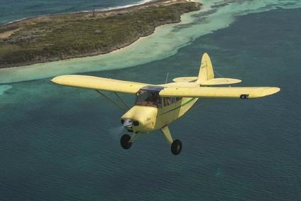 On the raft they hear their first aircraft. Timothy lights a fire so ...