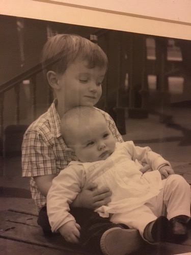 This is me holding my sister when i was about 3 years old.