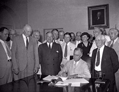 President Franklin Roosevelt signing the Social Security Bill, 1935.
