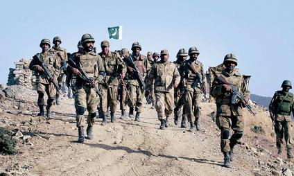 A group of Pakistani soldiers make their way towards combat.