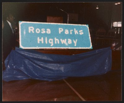 This is an image of the Rosa Parks Highway street sign being placed in ...
