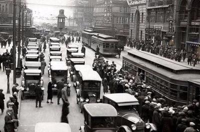 This image shows the change during the 1920s and we can see automobiles ...