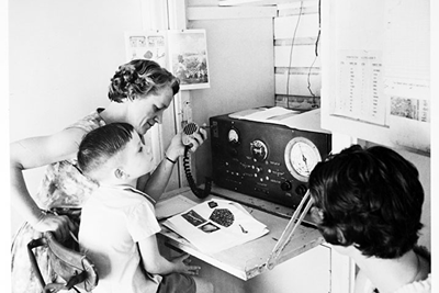 Students and teachers using the radio in a classroom while doing work!