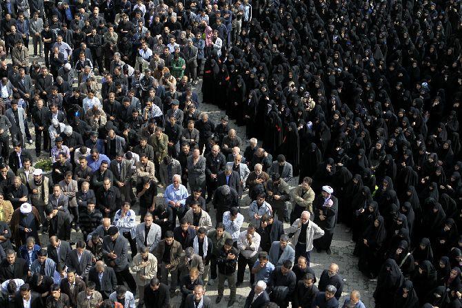 Iranians recover the remains of soldiers killed in Iran-Iraq war.