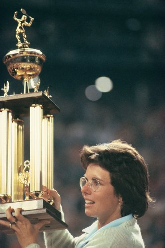 Billie Jean King holding her trophy after her win.