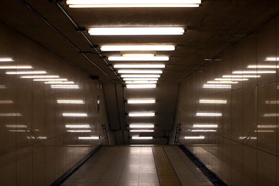 Linear fluorescent lamps illuminating a pedestrian tunnel