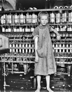 This child works in a factory where they make textiles for clothing.