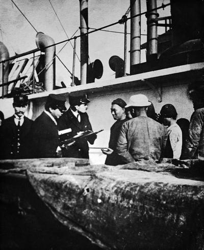 Immigrants being searched upon entrance