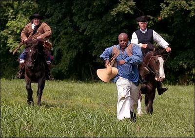 This is picture of a slave trying to escape while the masters are going ...