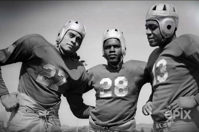 The first black NFL players dressed up int their uniforms