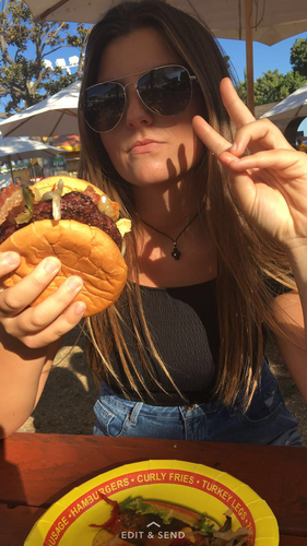 This is me consuming a very delicious burger at the OC fair!