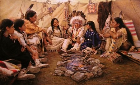 A Cherokee family sitting around a fire. http ...