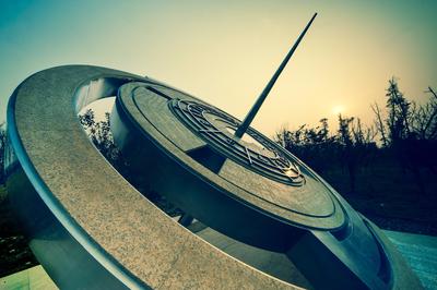 This sundial's platform is tilted to align with the latitude, and the ...