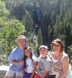 a picture of my dad, me, my brother, and mom