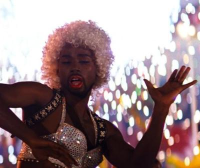 This is Mercutio dressed up as a girl so he can sneak into the Party.