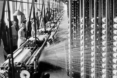 Women working with the Cotton Gin