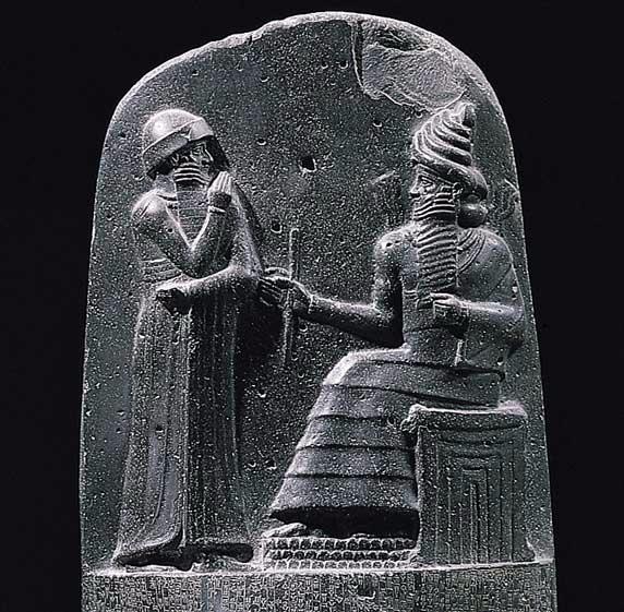 Hammurabi's code shown on a stone sculpture