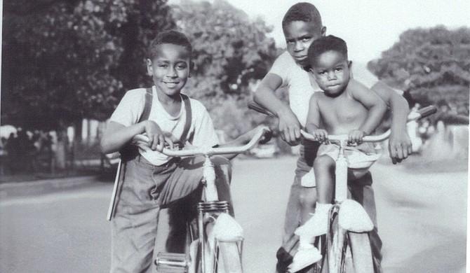 Emmett Till with his cousins. Emmett is far left.