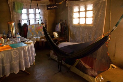 I was on my side, clutching the cords at the head of the hammock as I ...