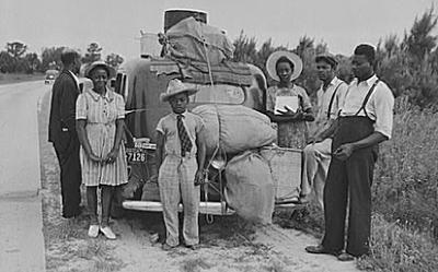 An image of a southern African American family ready to move to the North.