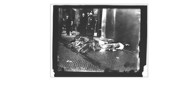Photograph of Police Officers, Civilians and Victims on the Sidewalk ...