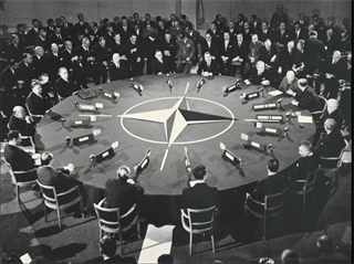 Twelve countries signing the North Atlantic Treaty in Washington D.C.