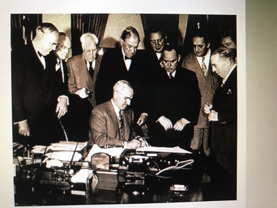 President Truman signing the Marshal Plan into law.