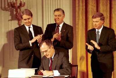 Nixon Signing the Clean Air Act next to Denis Hayes