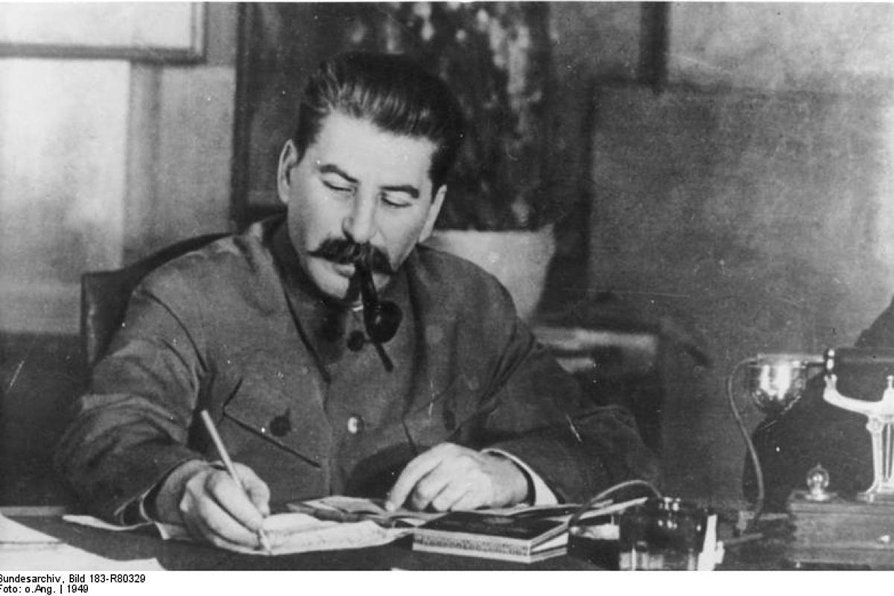 Photo of Joseph Stalin writing at his desk in 1949.