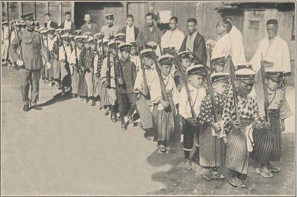 Boy Scouts being trained to shoot rifles during the Era of Taisho ...
