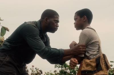 Cecil and his father working the cotton field