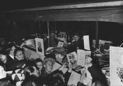 German students gather around seized "un-German" books. Photograph ...