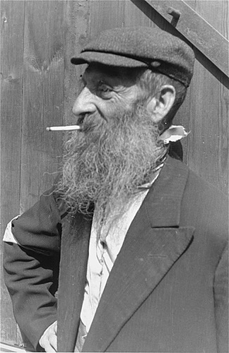 Portrait of a Jewish man smoking in Warsaw Ghetto