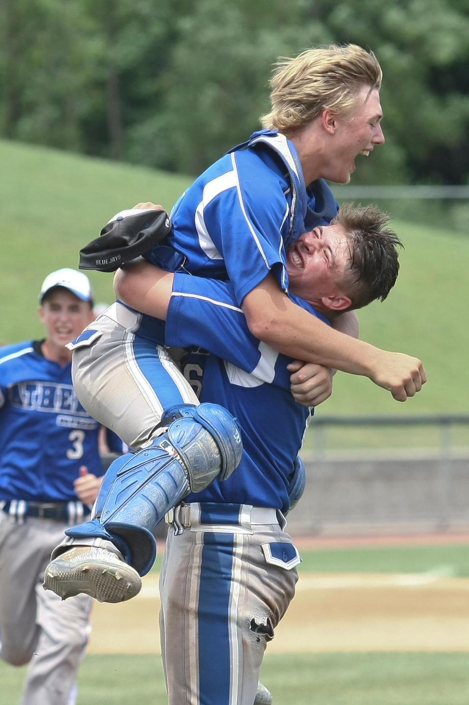 Athens catcher Connor Westfall jumps into the arms of pitcher Marshall ...