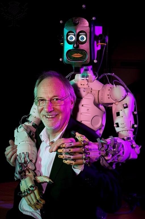 Man with a robot next to him.