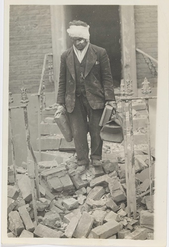 Photograph: 'Injured Man Salvages Belongings'. Picture issued 18 ...