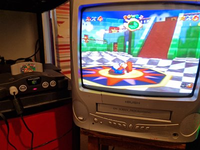 The Flagship title of the N64 Mario 64 on a old CRT TV